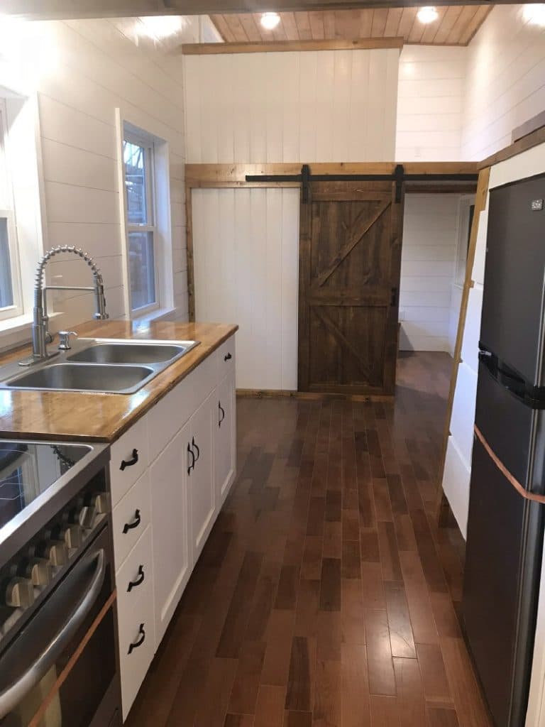 This Cute Little Log House Measures Just 9’ x 28’ and Has Three ...
